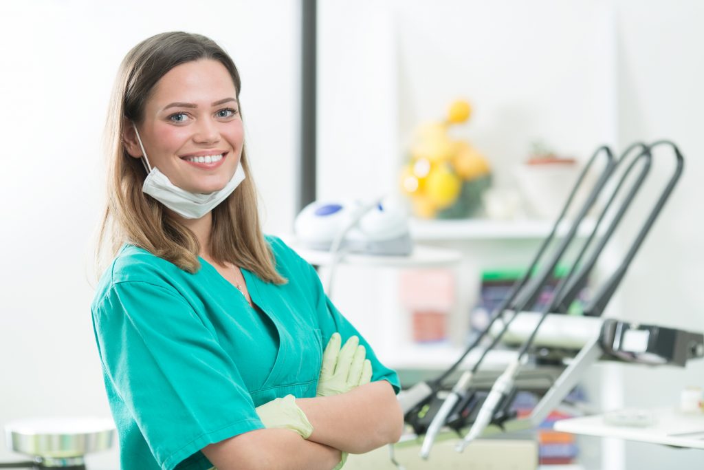 happy professional dental assistant - Off the Cusp